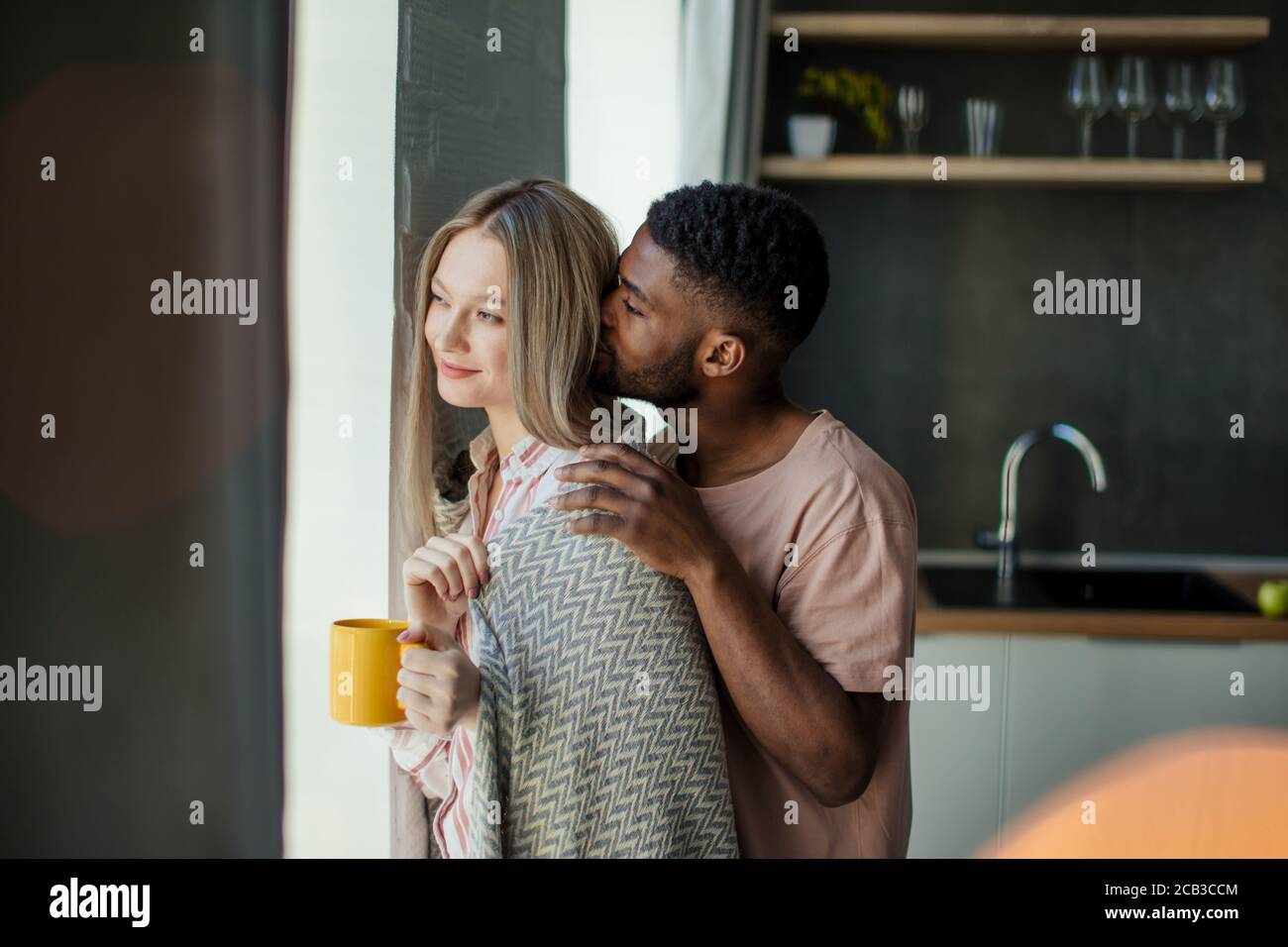 Multi-ethnic relationships concept. African young man looking at his ...