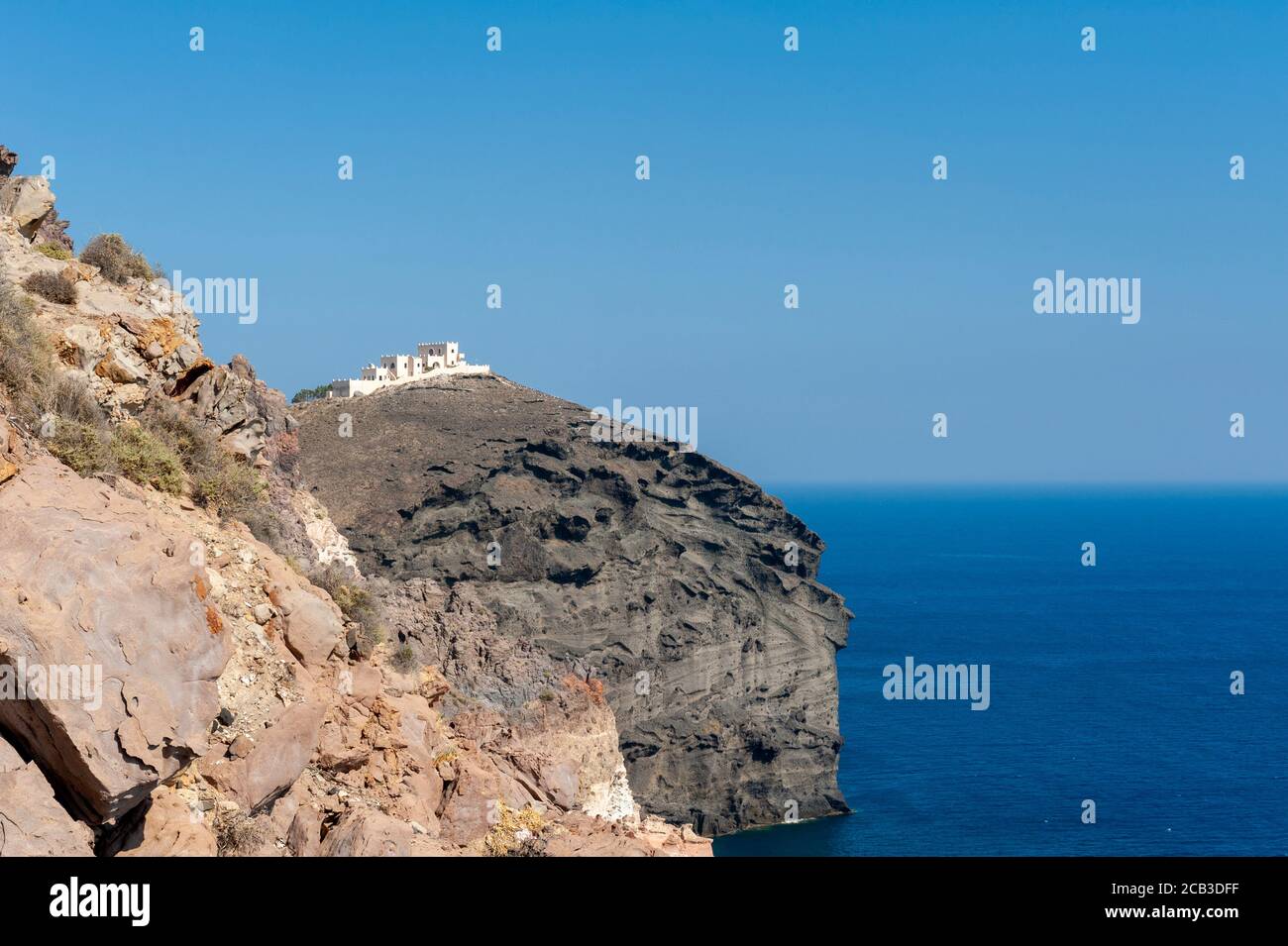 White building built on a cliff top. Santorini,Greece,greek islands ...