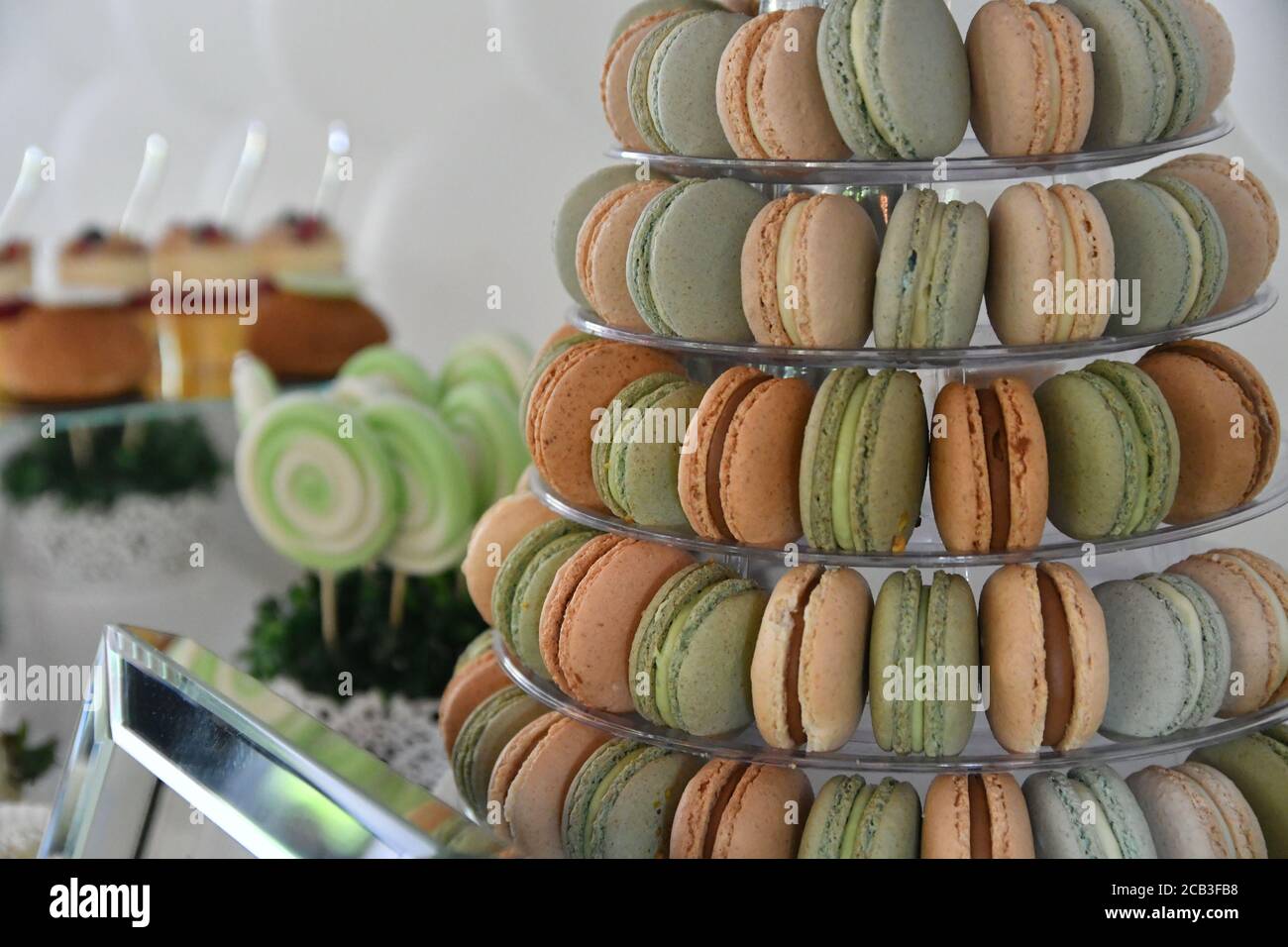 Closeup shot of delicious macarons with other desserts on the table ...
