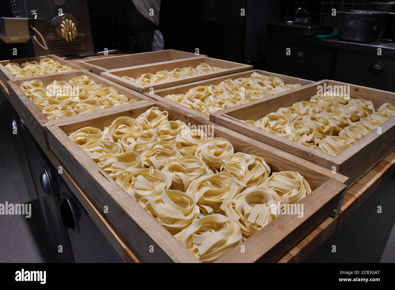 Process of making organic pasta with machinery Stock Photo - Alamy