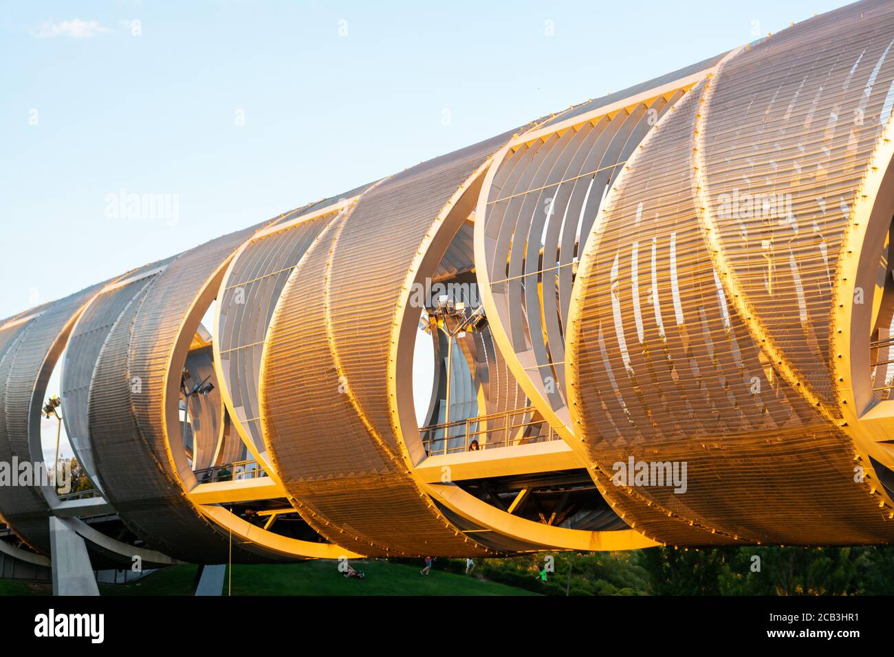 A metal bridge, footbridge a spatial truss with circular cross section ...