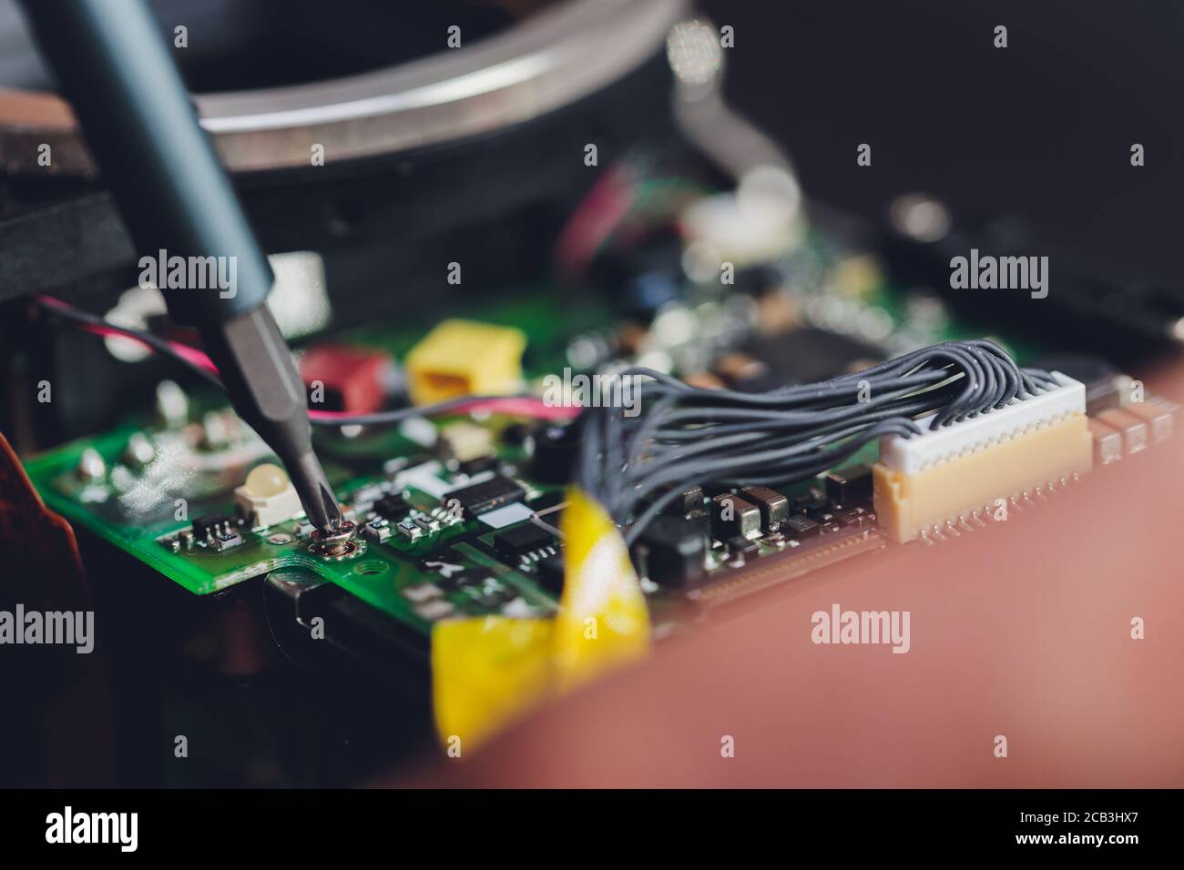 Engineer and technician Minitures are fixing camera mirror box assembly ...