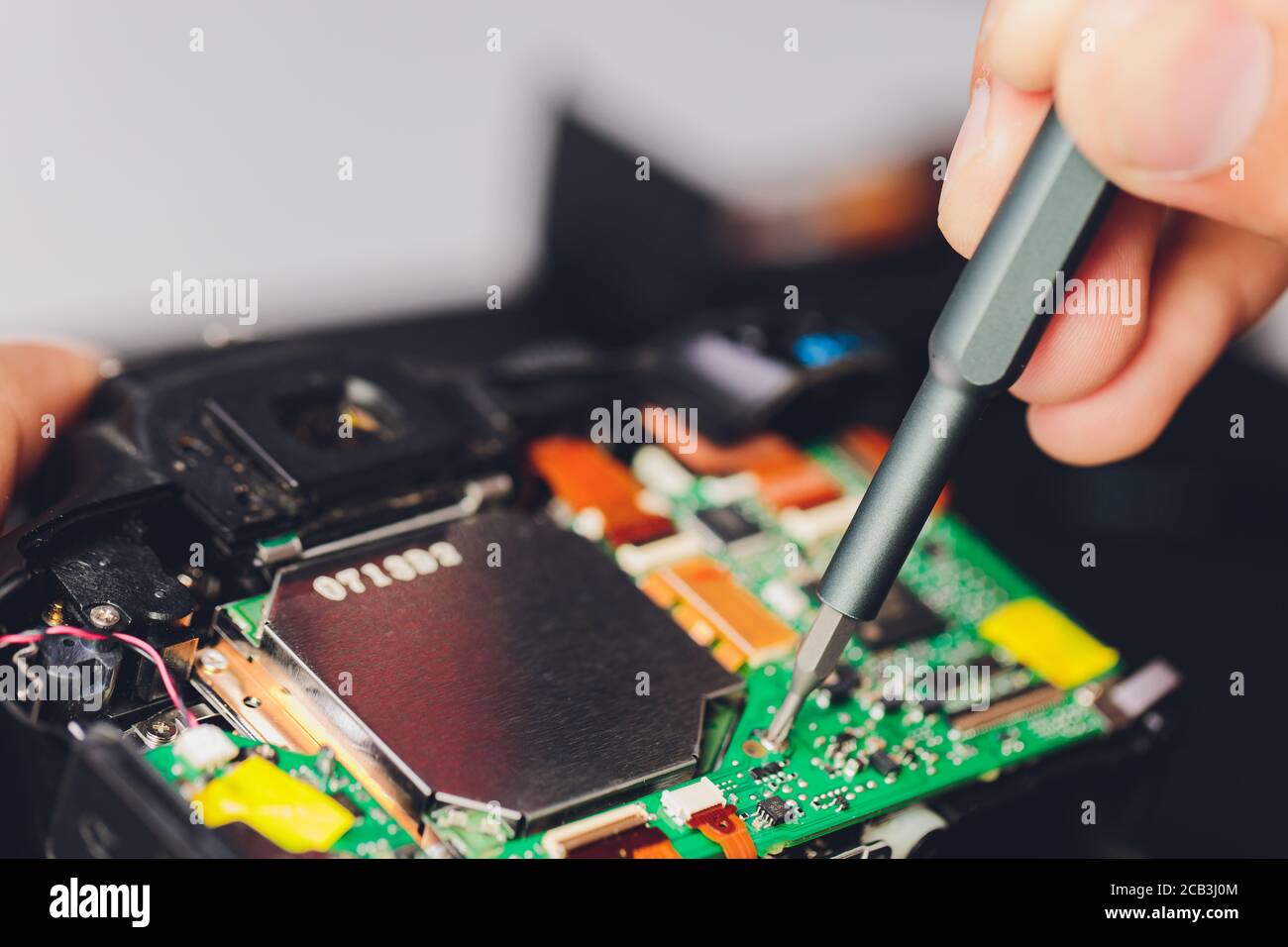 Engineer and technician Minitures are fixing camera mirror box assembly ...