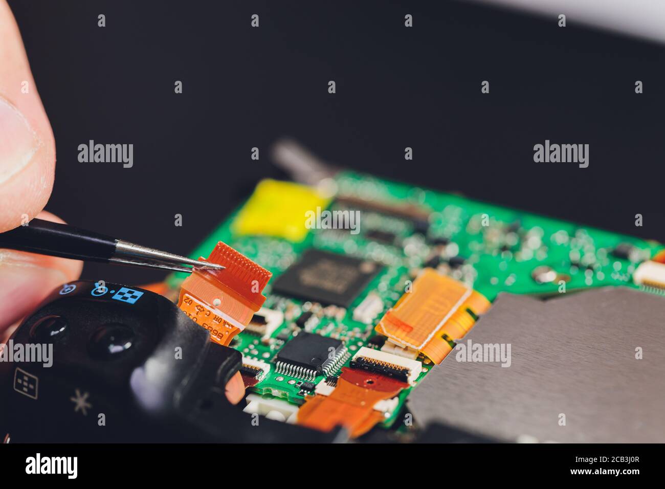 Engineer and technician Minitures are fixing camera mirror box assembly ...