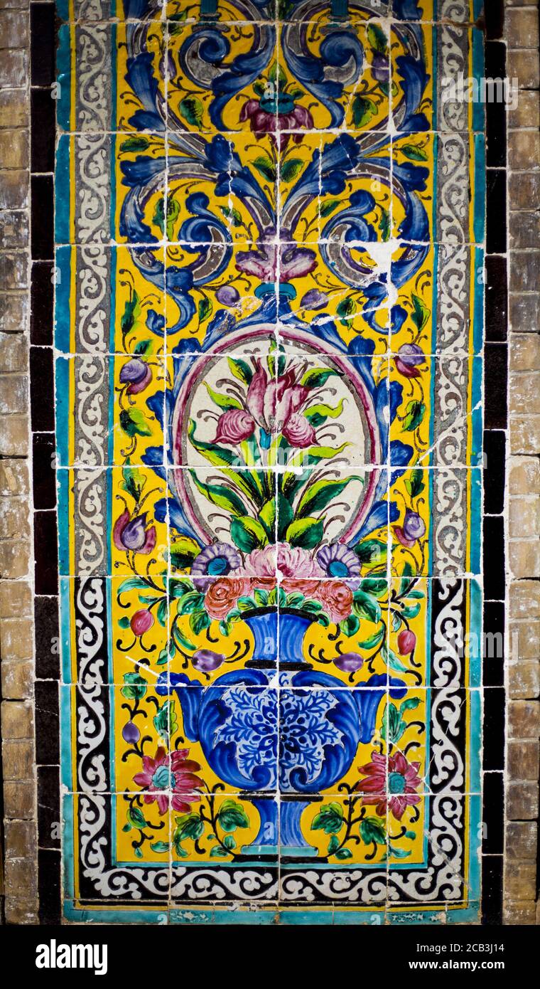 Vertical shot of a ceramic wall texture with painted colorful patterns ...