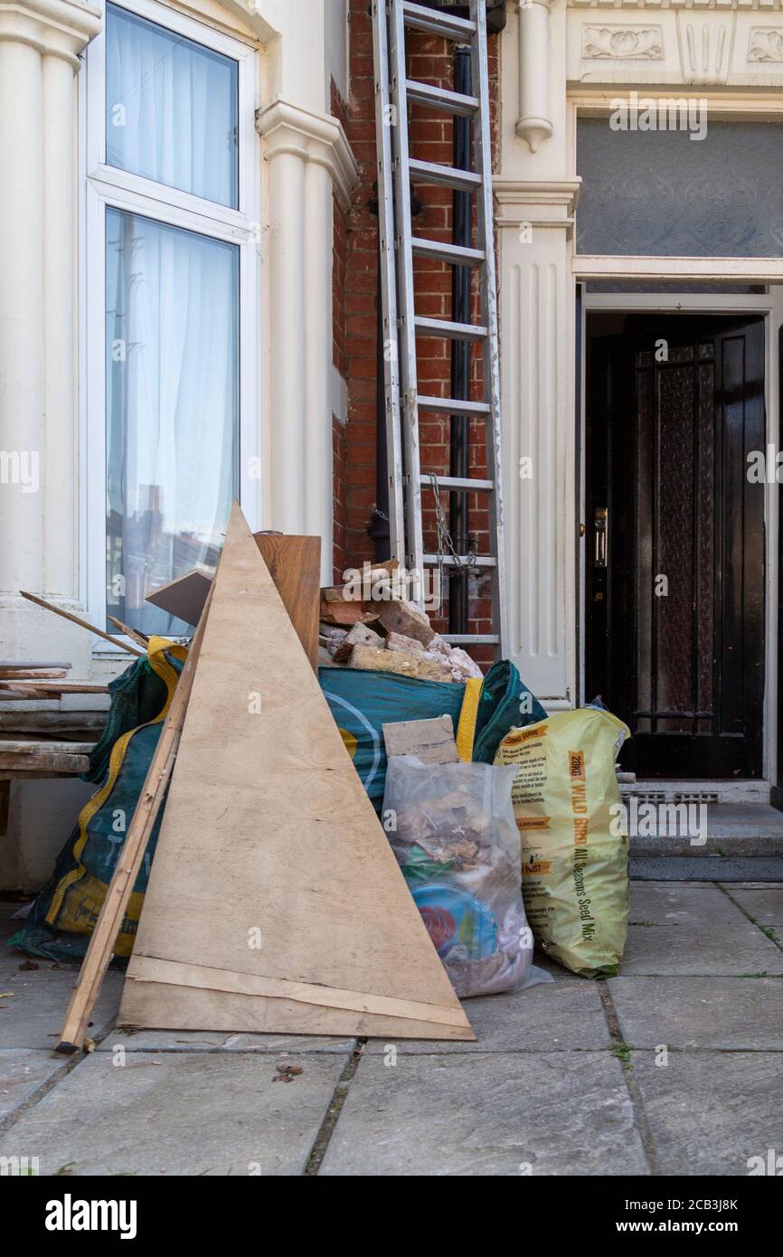 builders rubbish and rubble outside a house under renovation Stock ...