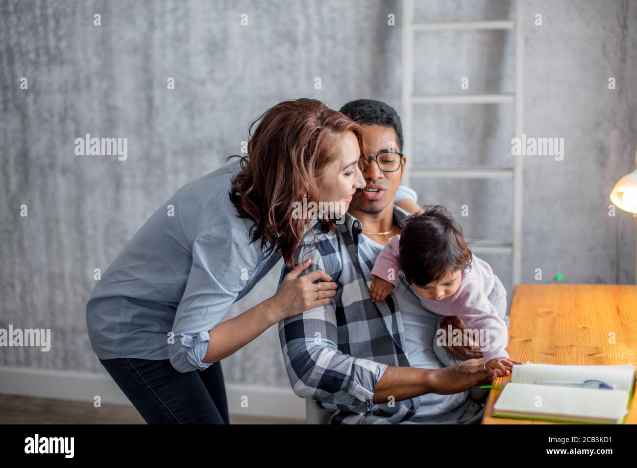 happy parents having fun with a baby, close up photo Stock Photo - Alamy