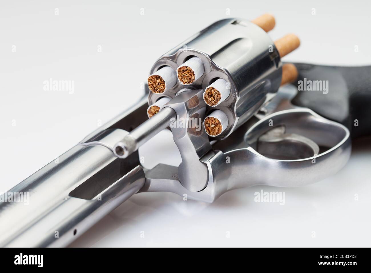 Revolver Loaded With Cigarettes - Smoking Kills Stock Photo - Alamy