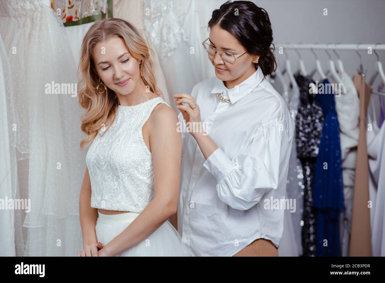 Selecting wedding dresses hi-res stock photography and images - Alamy