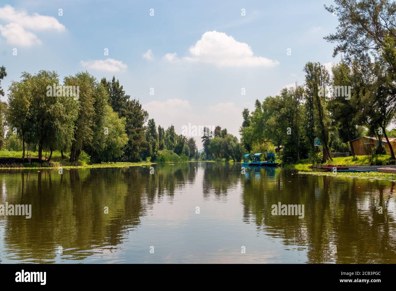 Landscape of the Cuemanco canal in Xochimilco, Mexico City. Calm river ...