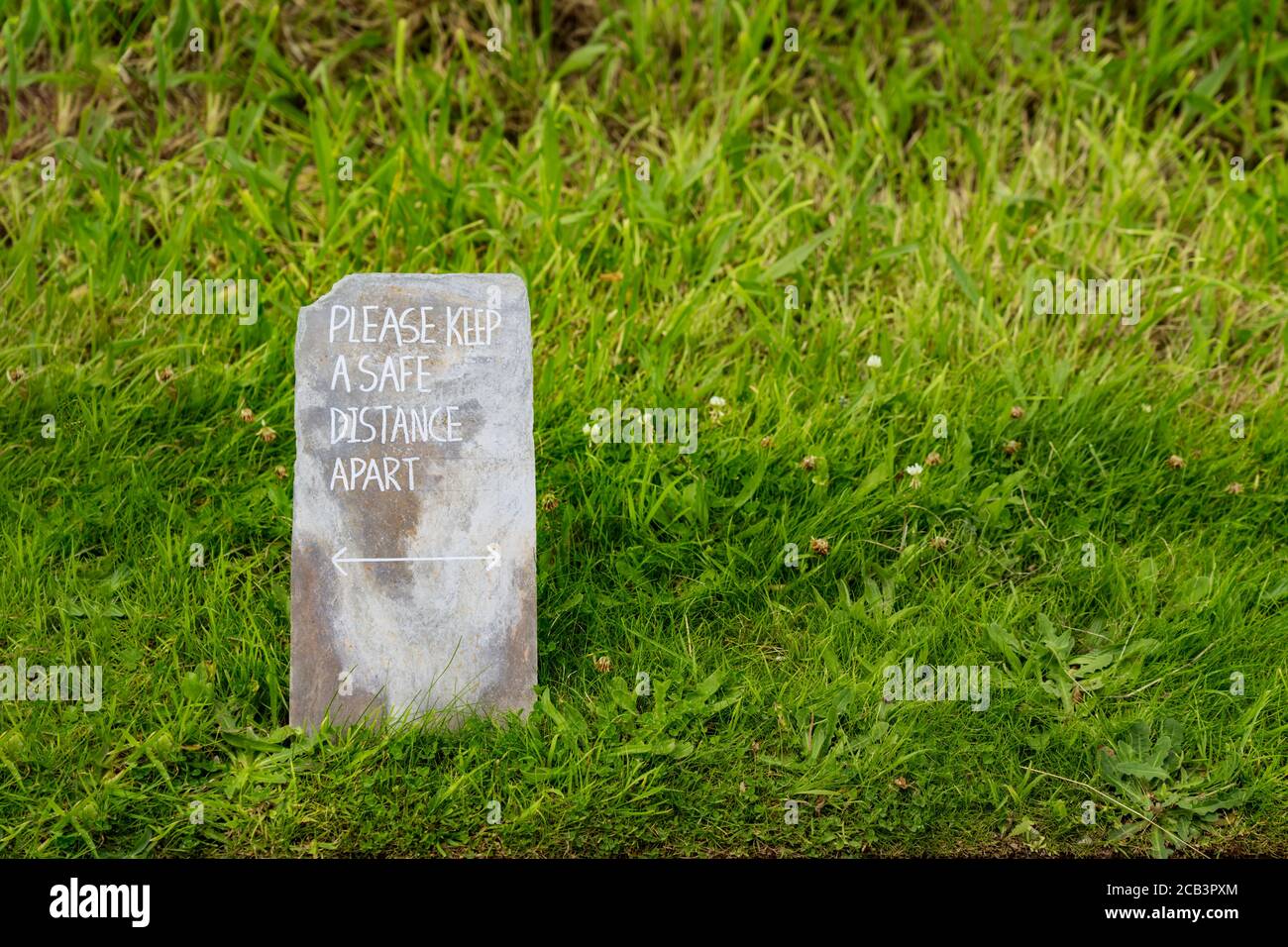 Message with Please keep a safe distance on the grunge metal board ...