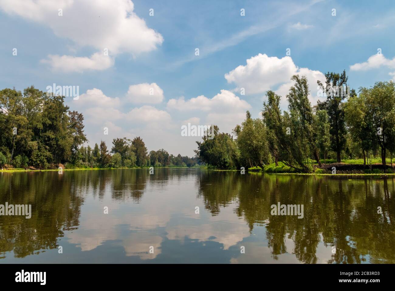 Landscape of the Cuemanco canal in Xochimilco, Mexico City. Calm river ...
