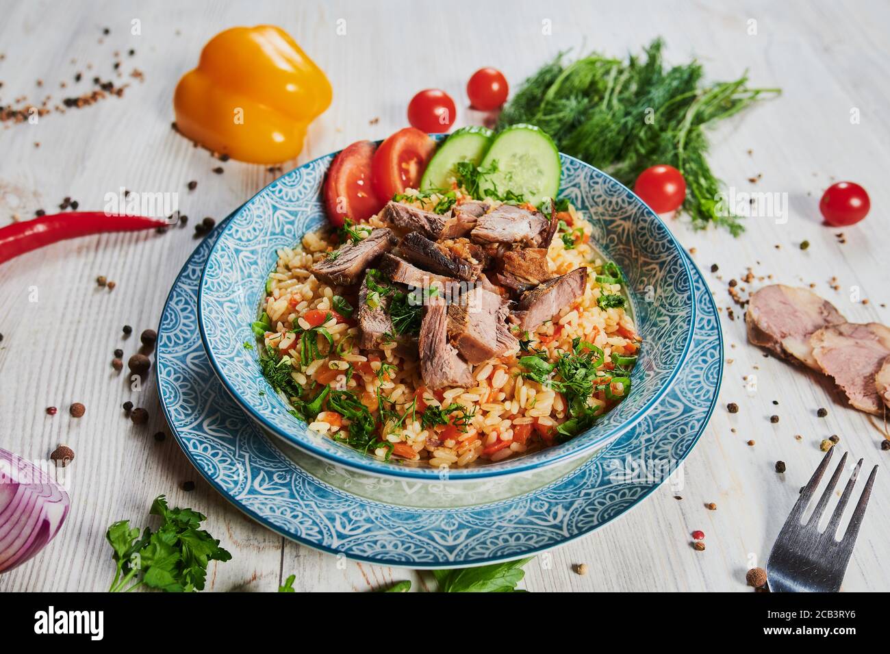 Rice pilaf with lamb meat and vegetables Stock Photo - Alamy