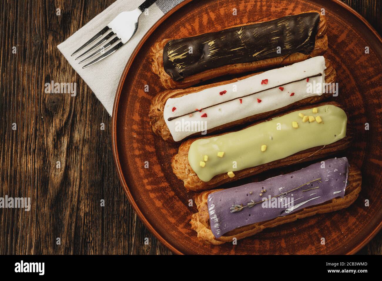 Group of colorful eclair cakes close up Stock Photo - Alamy