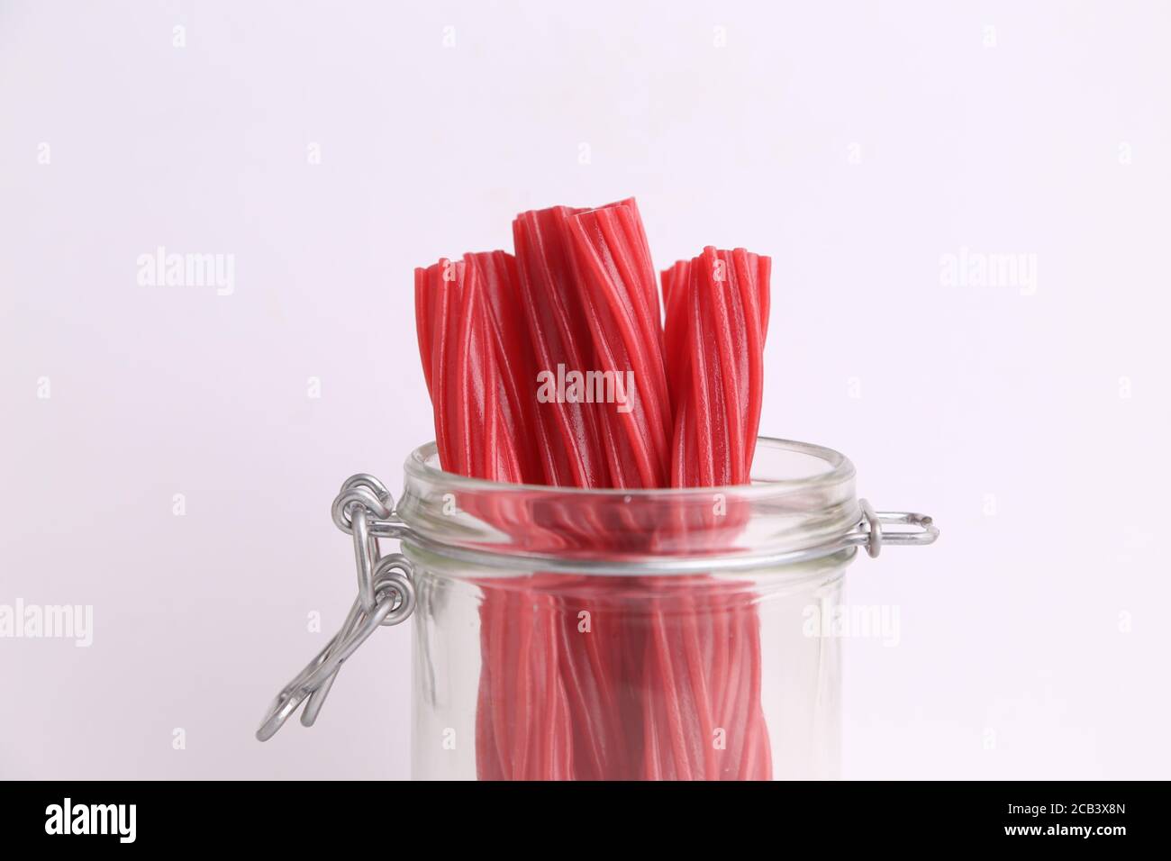 Sweet red candies in the glass jar Stock Photo - Alamy