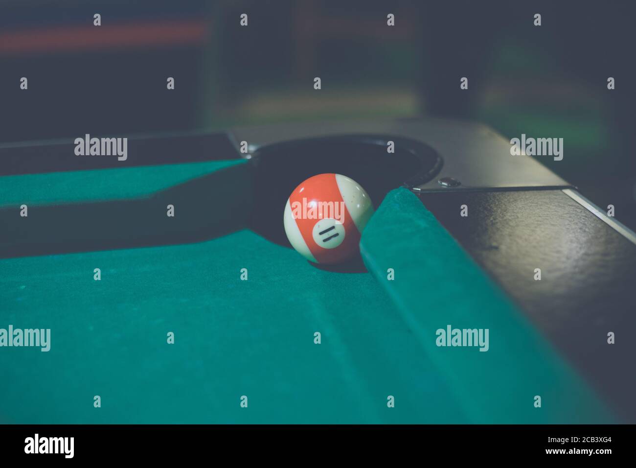 Red, number 11, billiard ball in a pool table. Vintage style noise ...