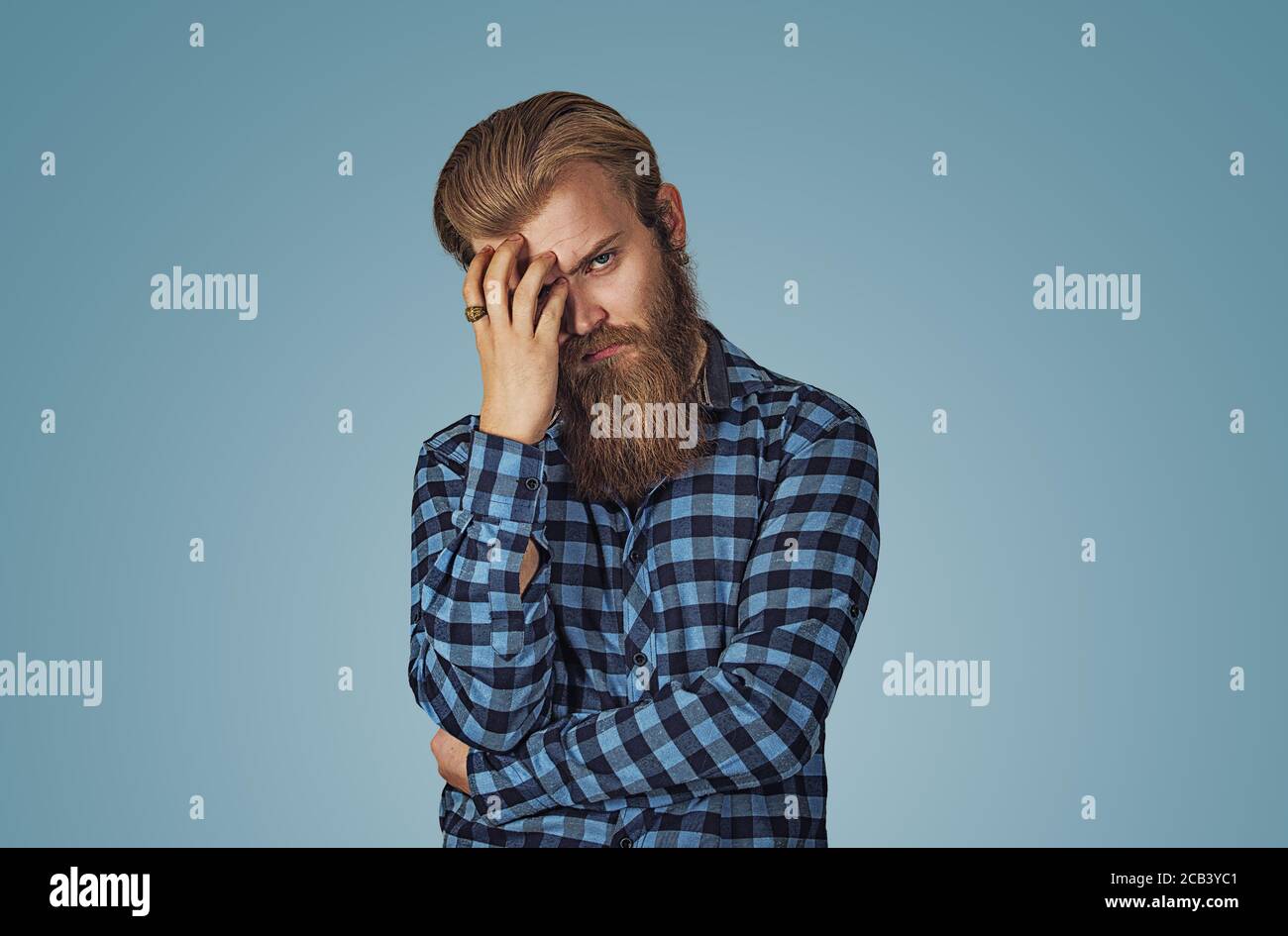 Closeup portrait sad young handsome bearded man with worried negative ...