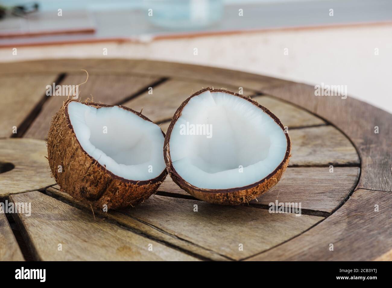 Halves Coconuts: selective focus of fresh tasty coconut half on wooden ...