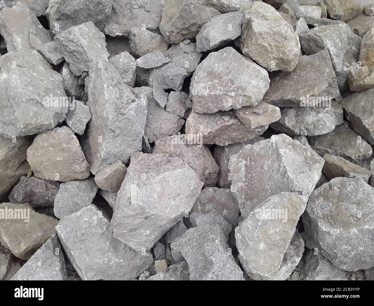 Pile of crushed granite stones Stock Photo - Alamy