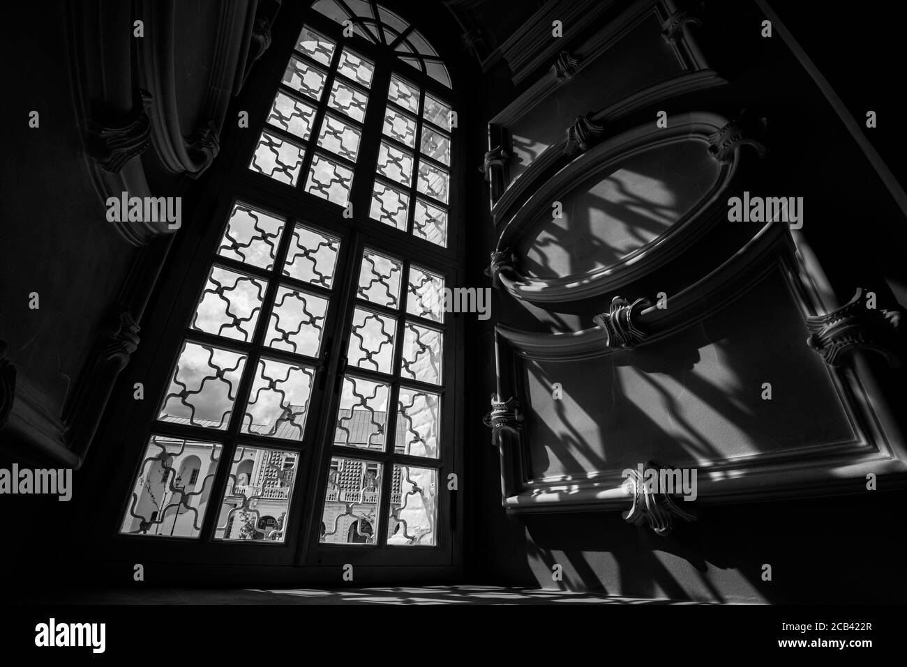 Interior of orthodox church, baroque style with window, shadows and sun ...