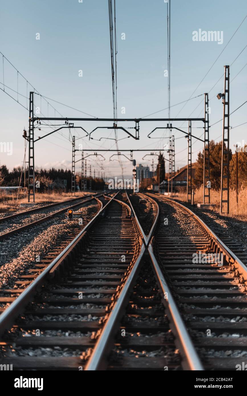 Vertical shot of old railways at sunset Stock Photo - Alamy