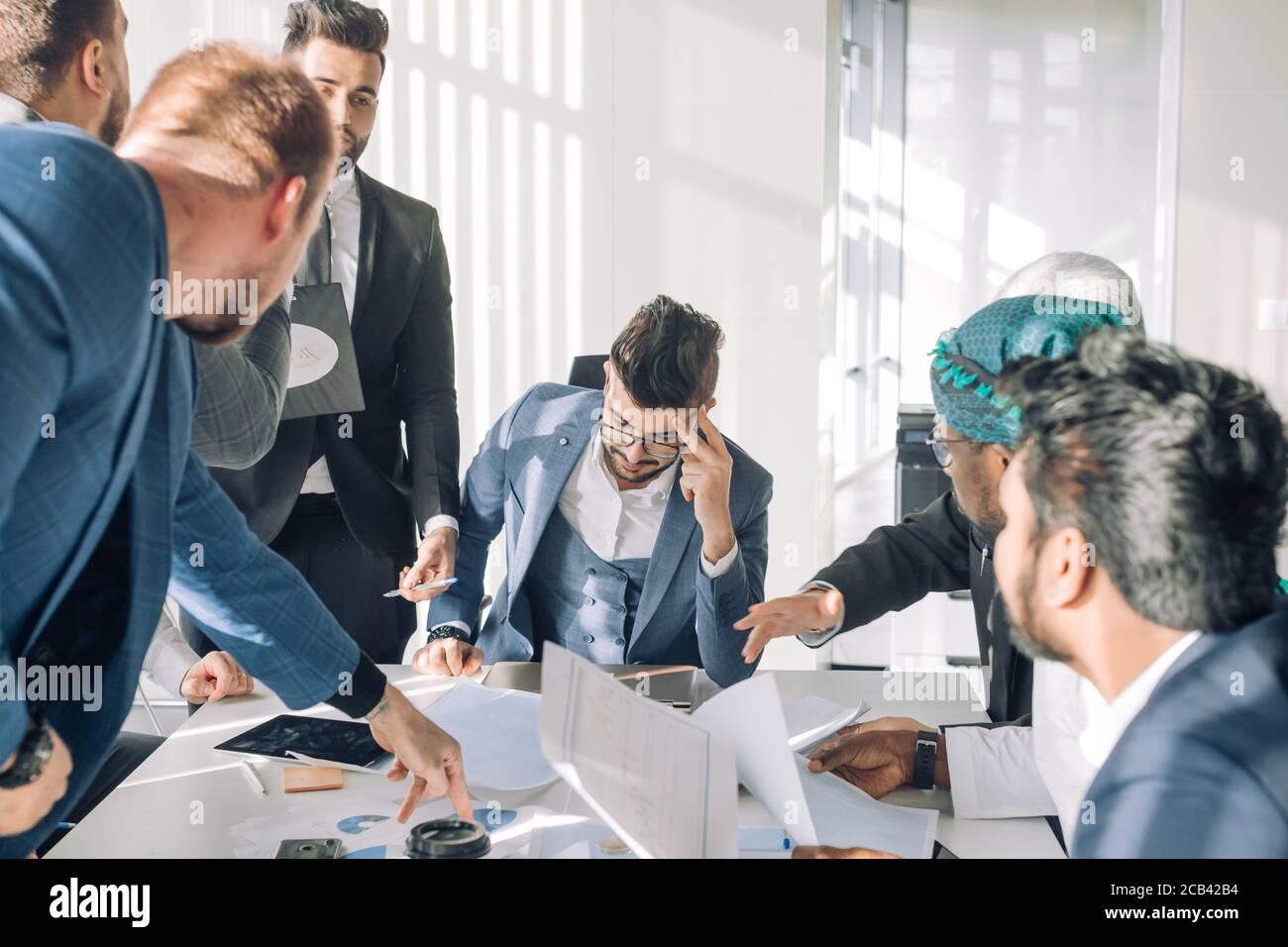 Conflict on business meeting with team. Young male Chief Executive ...