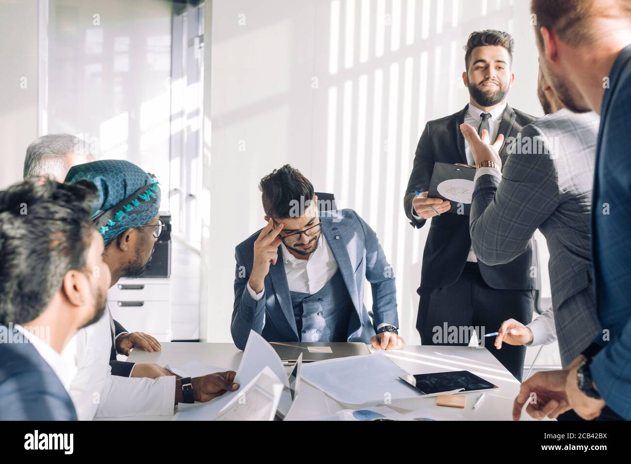 Conflict on business meeting with team. Young male Chief Executive ...