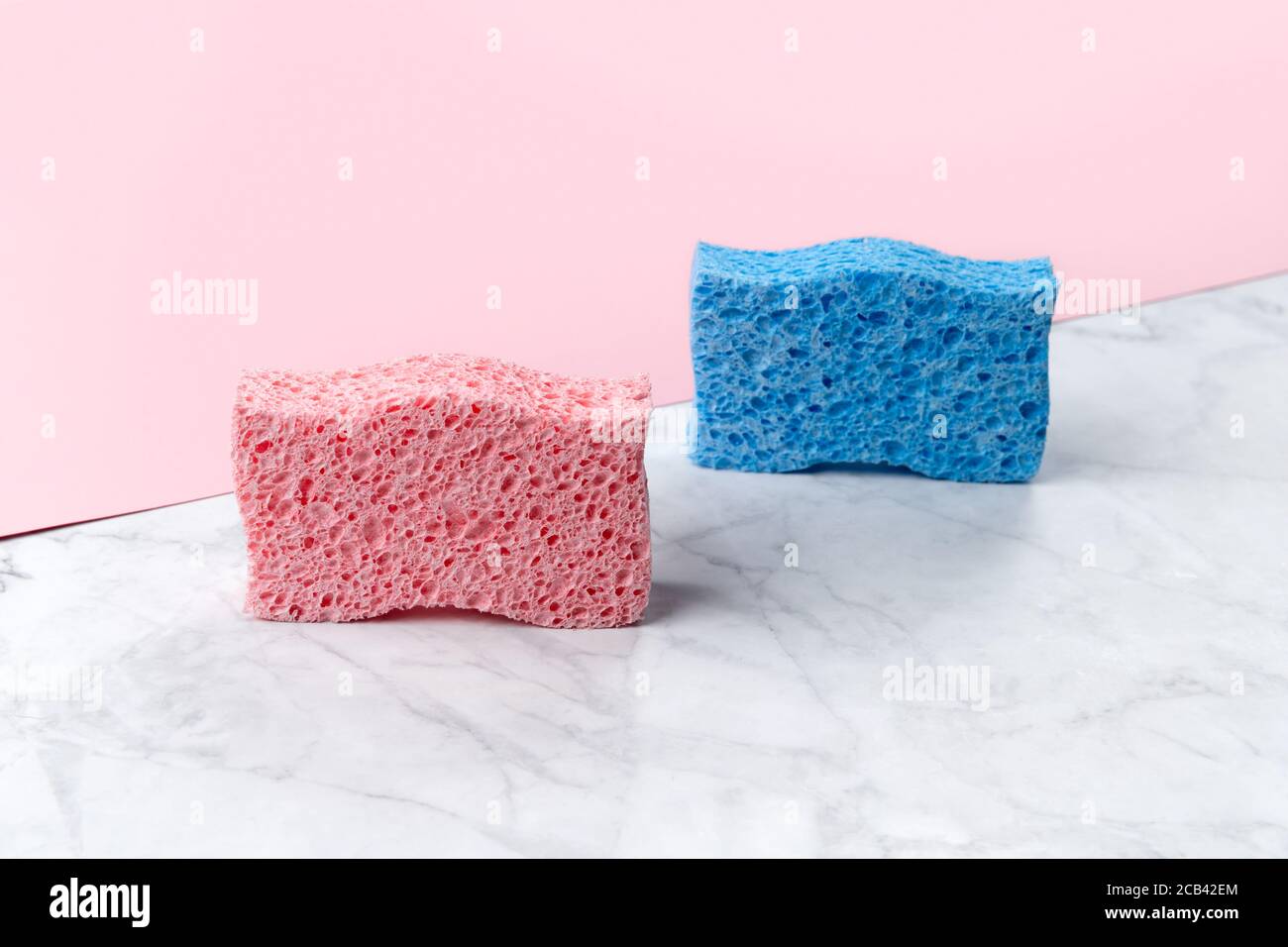Creative layout with sponges on pink and marble background Stock Photo ...