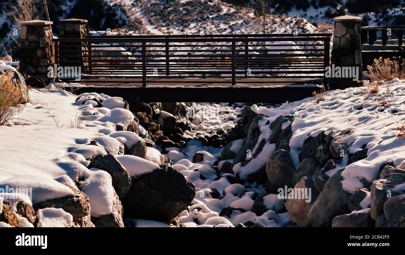 Wooden bridge over an iced river in winter Stock Photo - Alamy