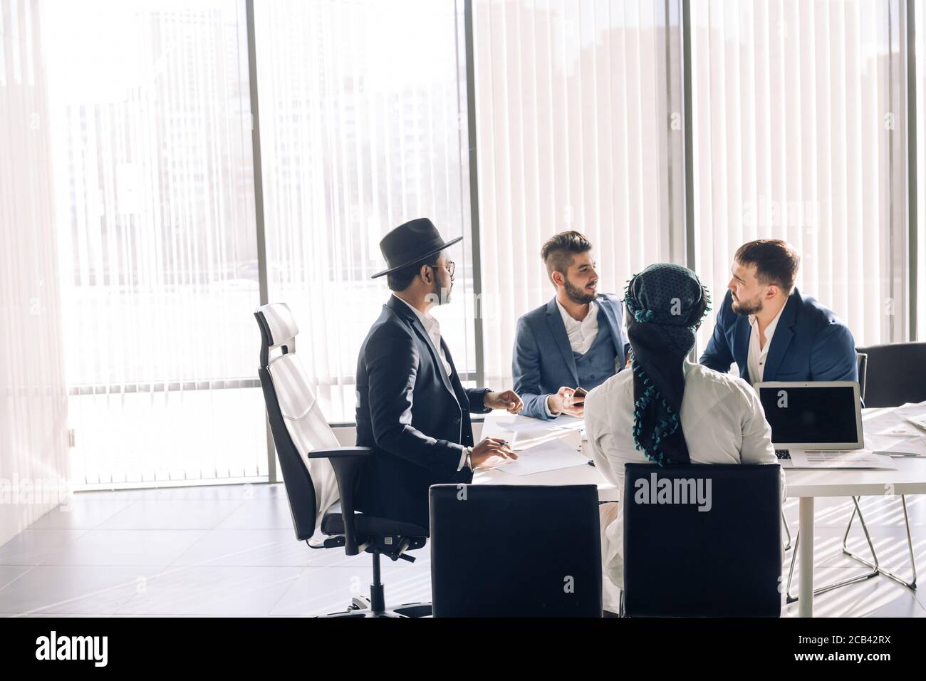 Business meeting between multiracial upper management board members in ...