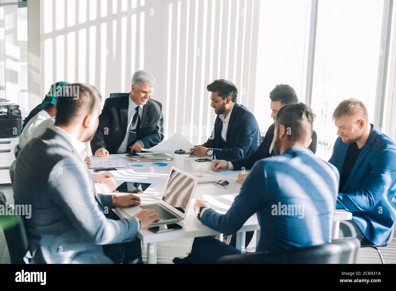 onstruction company management board members headed by grey-haired ...