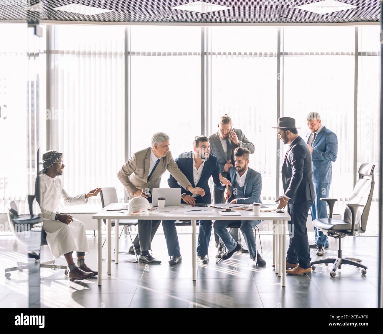Hot debates. Group of interracial business partners disagree with ...