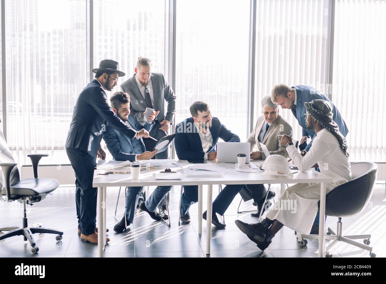 Working atmosphere in the office, focus on caucasian chief executive ...