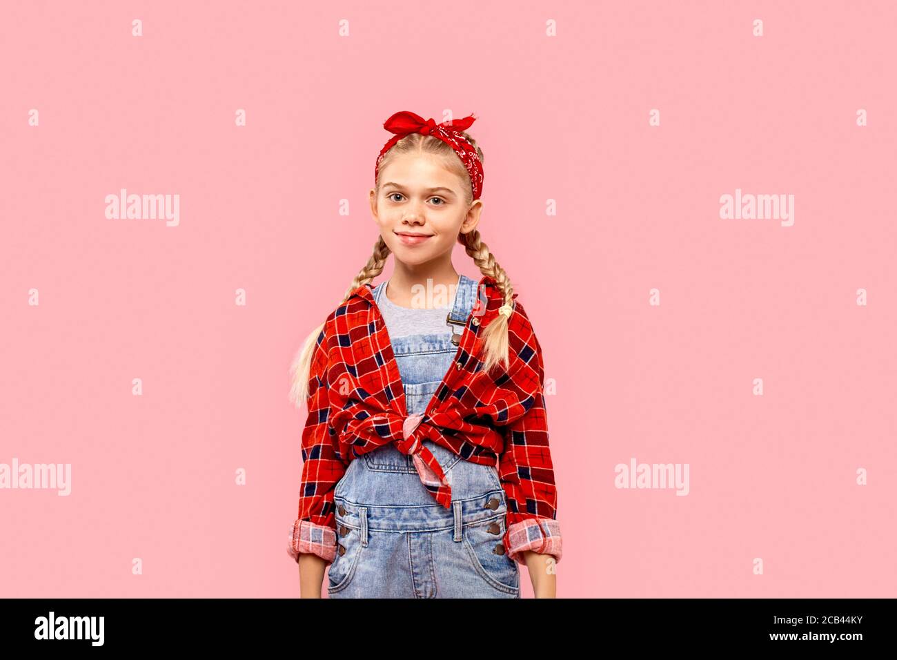 Young girl with smiling face looking at camera Stock Photo - Alamy