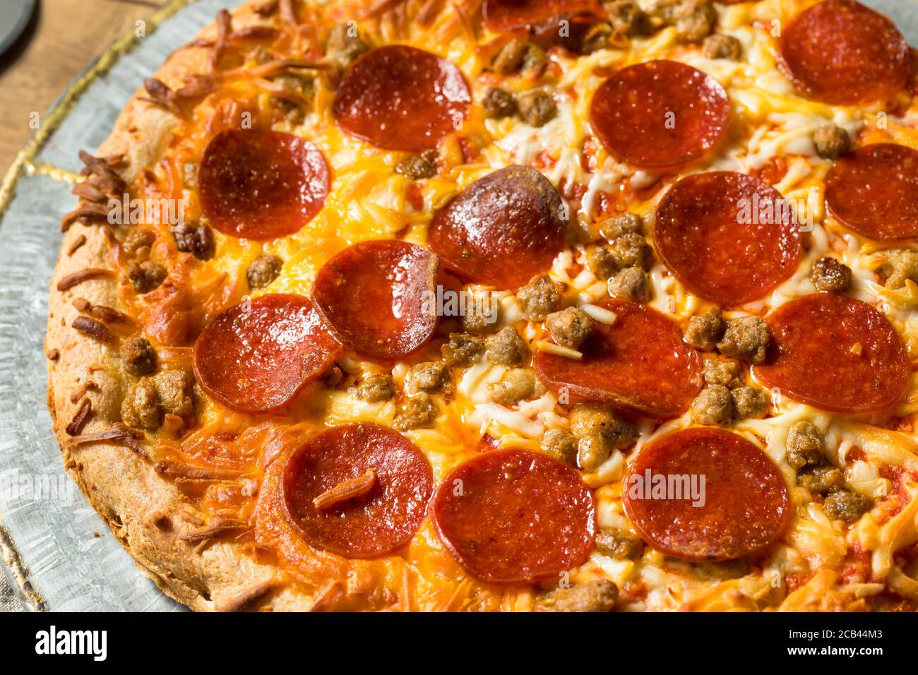 Homemade Meat Lovers Pepperoni Pizza with Sausage and Bacon Stock Photo ...