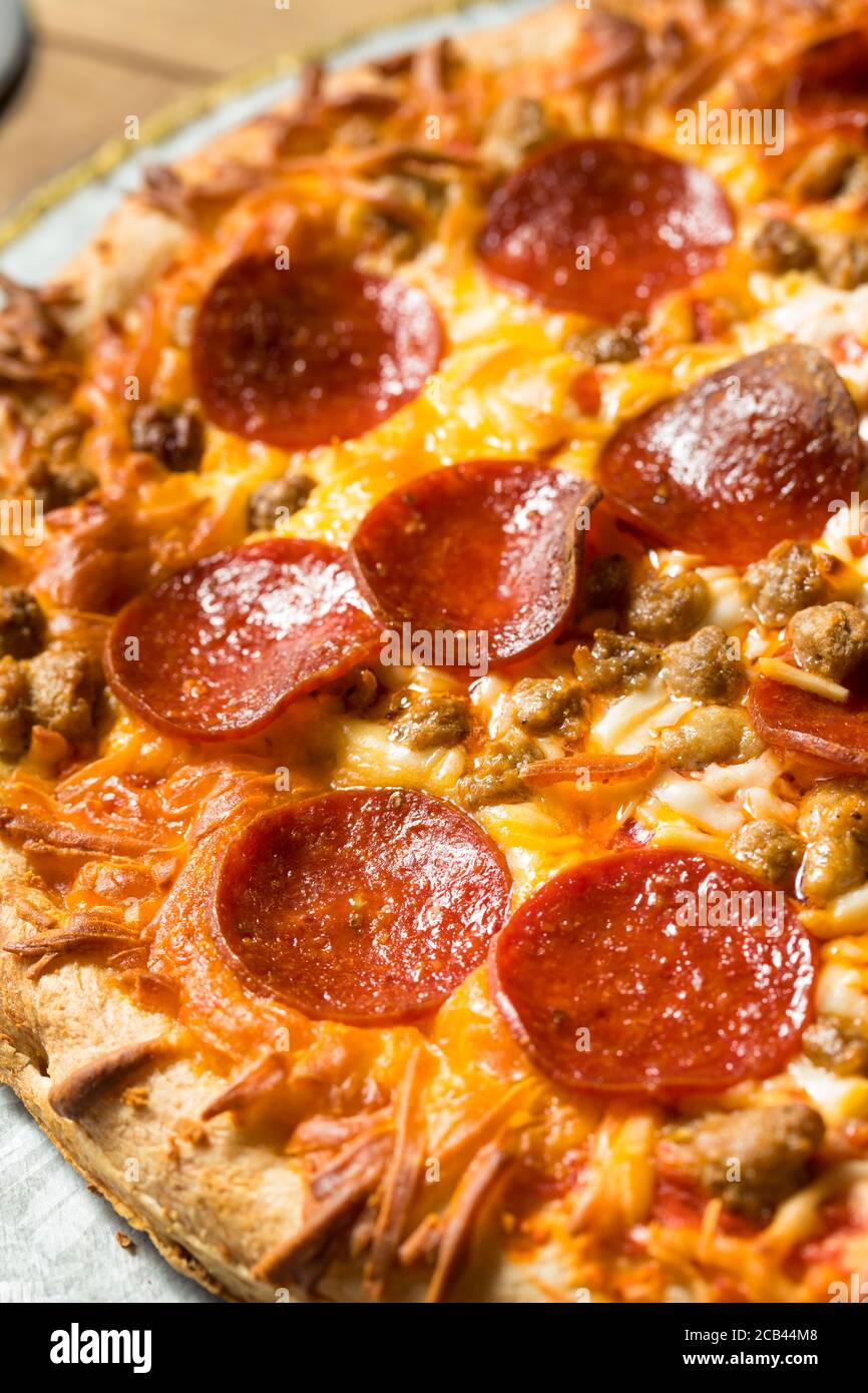 Homemade Meat Lovers Pepperoni Pizza with Sausage and Bacon Stock Photo ...