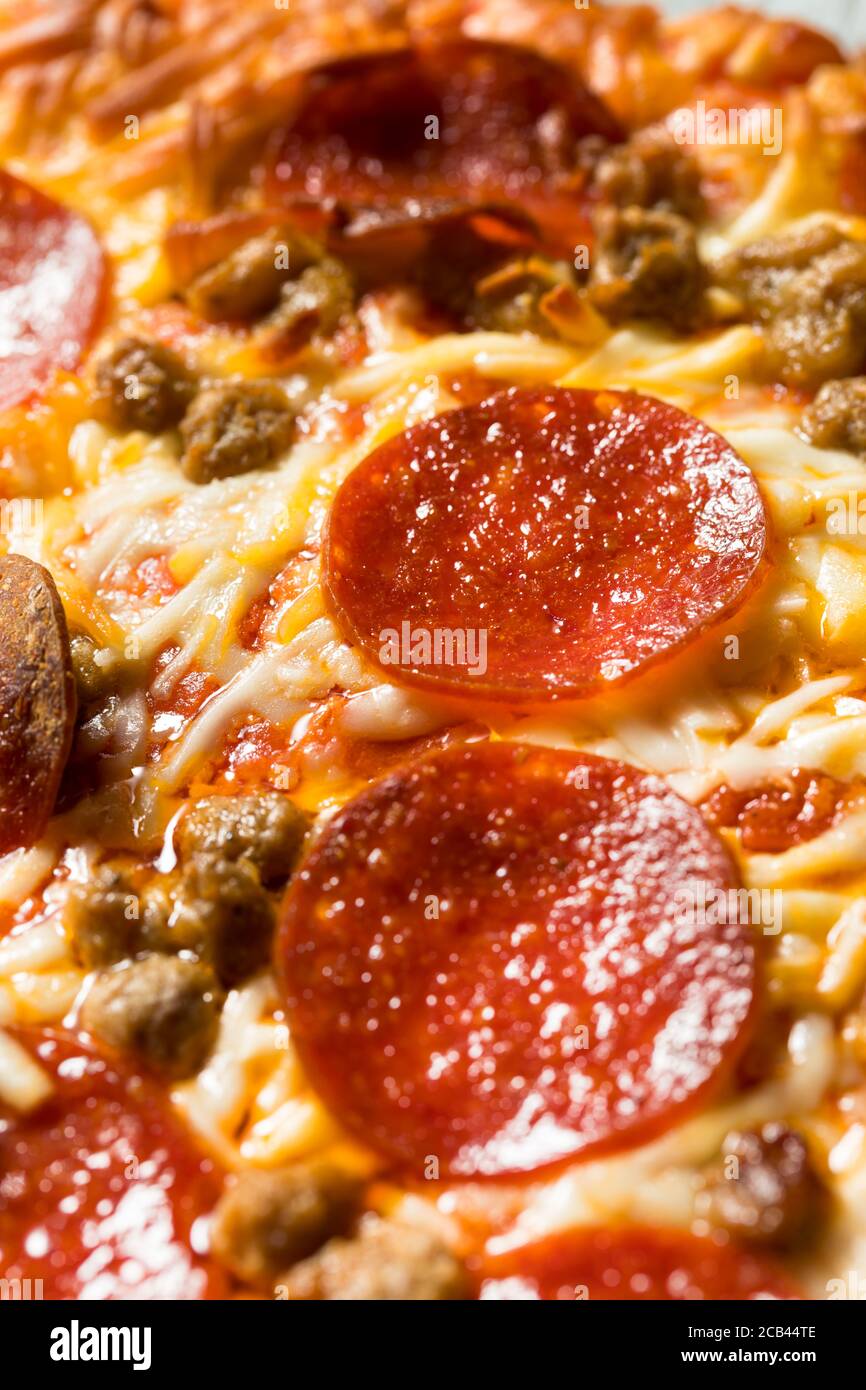 Homemade Meat Lovers Pepperoni Pizza with Sausage and Bacon Stock Photo ...