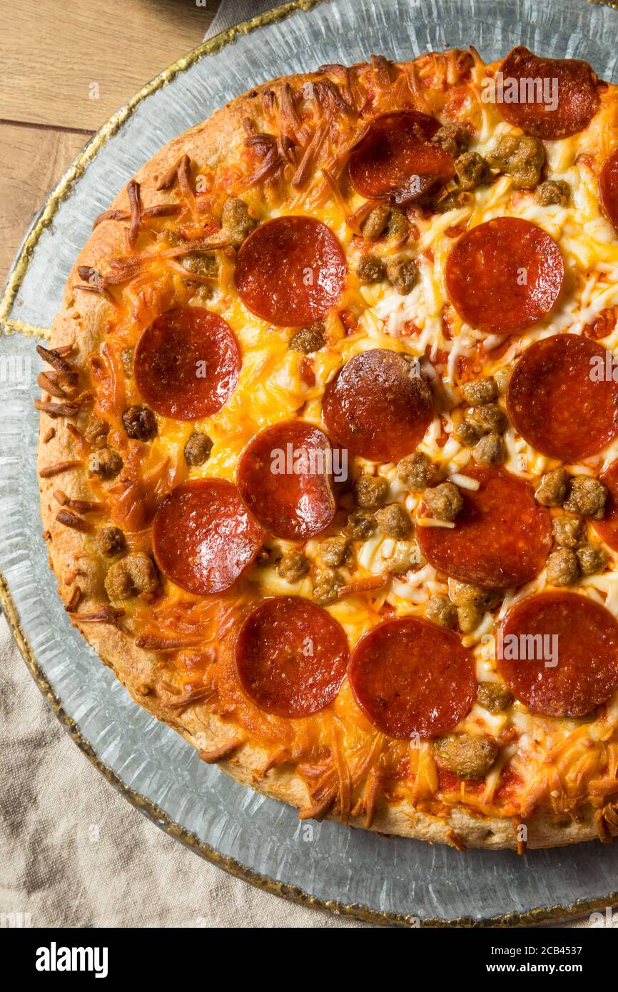 Homemade Meat Lovers Pepperoni Pizza with Sausage and Bacon Stock Photo ...