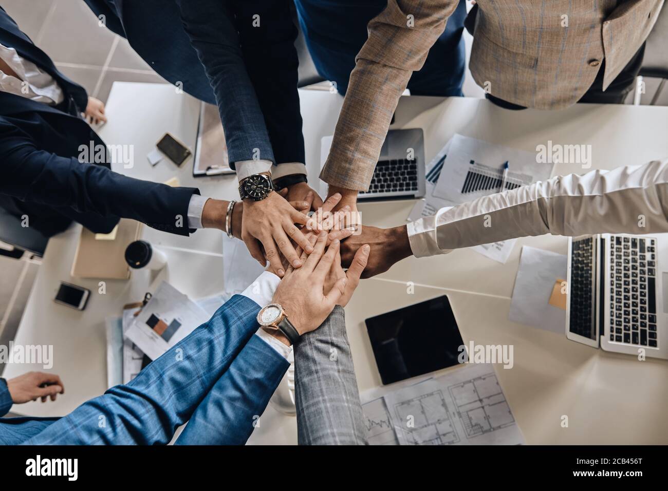 employees supporting each other, top view photo. likeminded people ...