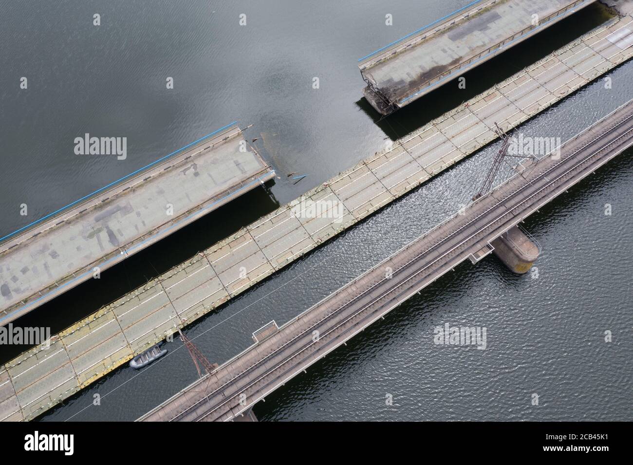Damaged road bridge across the river. Drone view Stock Photo - Alamy