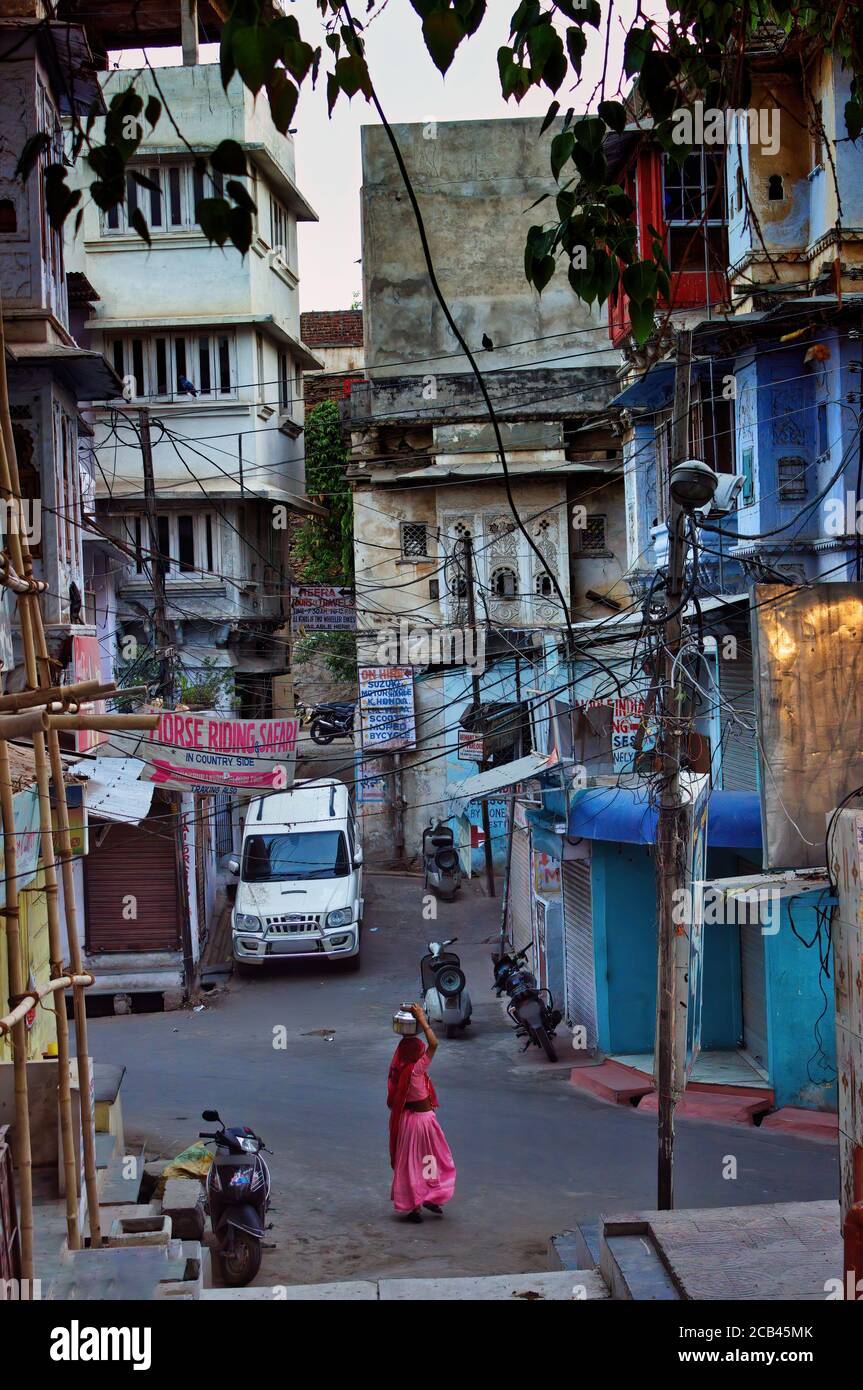 A woman carrying ghada ( Jar ) of water on head in the street of ...