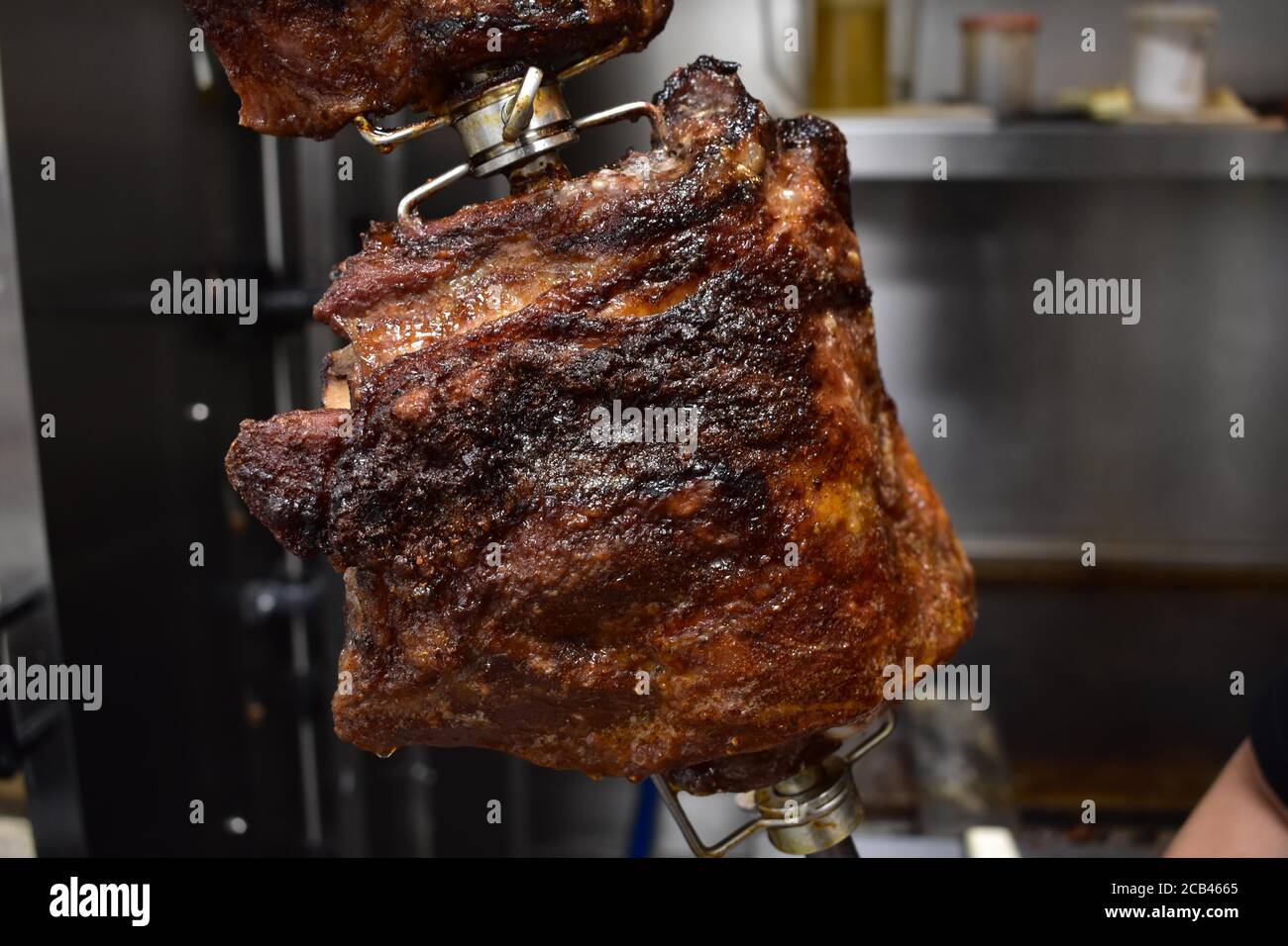 A Close Up of a Well-Done Rack of Ribs inside a Rotisserie Stock Photo ...