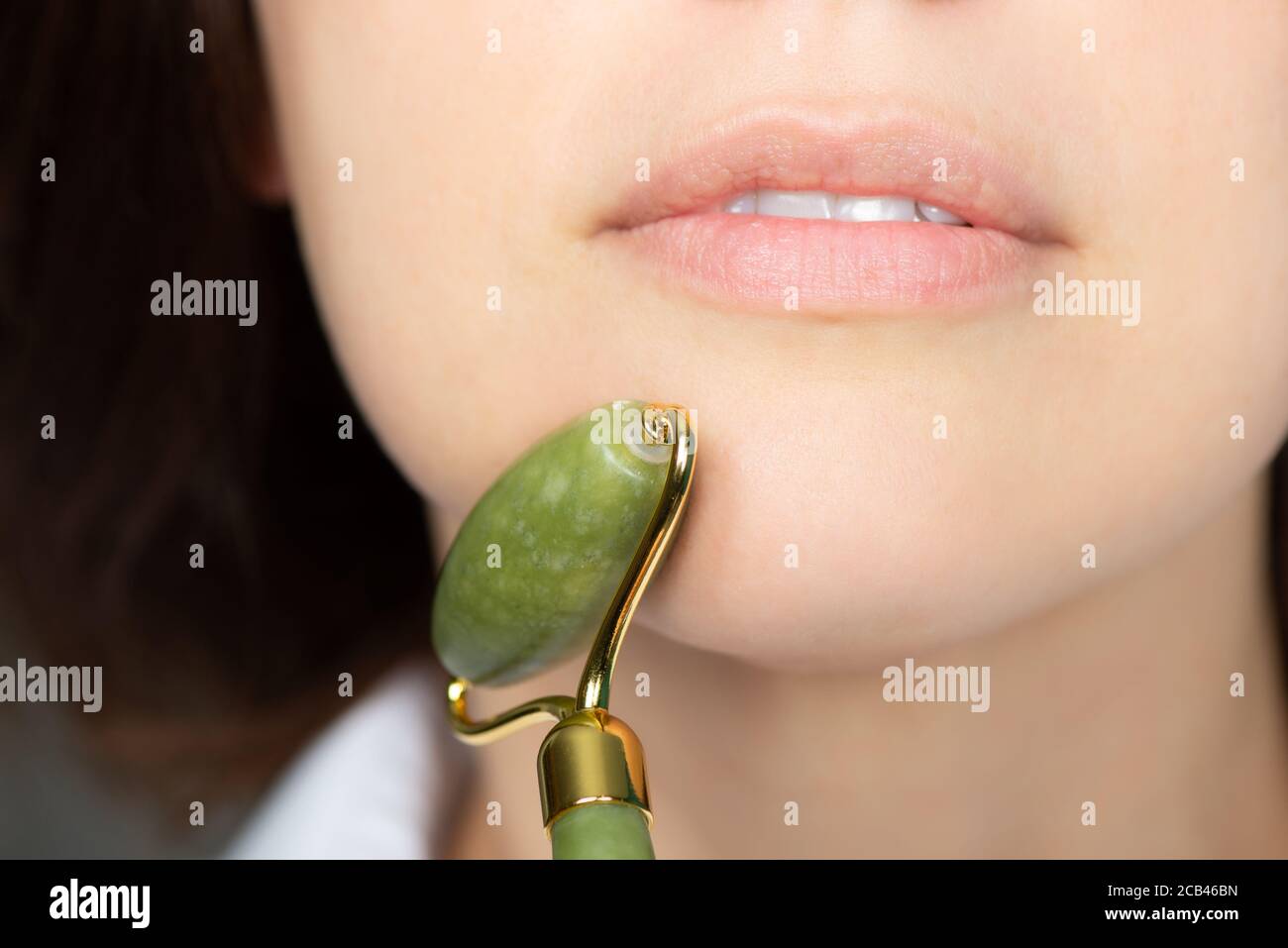 Young woman face guasha hi-res stock photography and images - Alamy