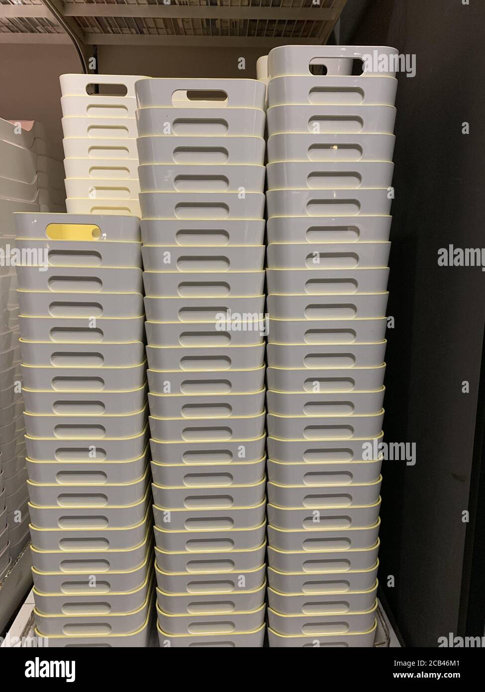 Vertical shot of a stack of storage boxes in a store Stock Photo - Alamy