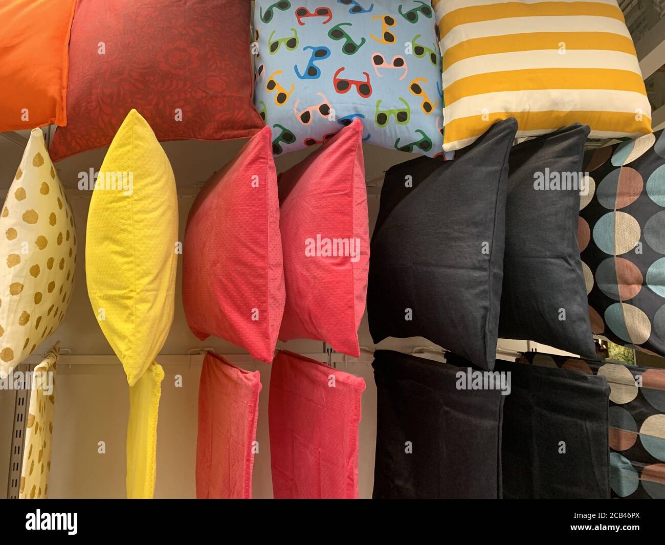 Closeup shot of various types of pillows in a shelf in a store Stock ...