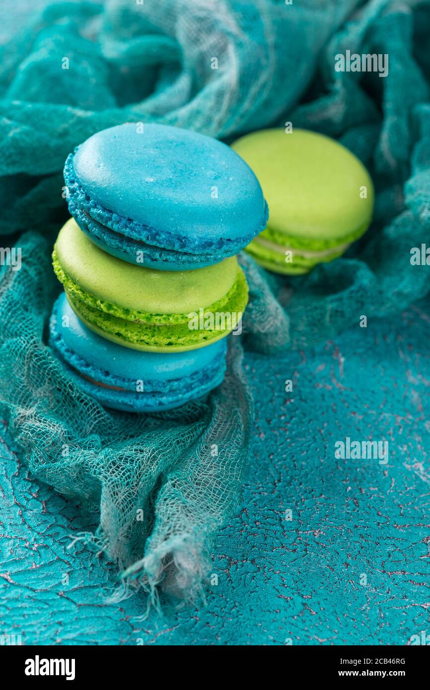 Cookies macaroon blue and green color on a turquoise background Stock ...