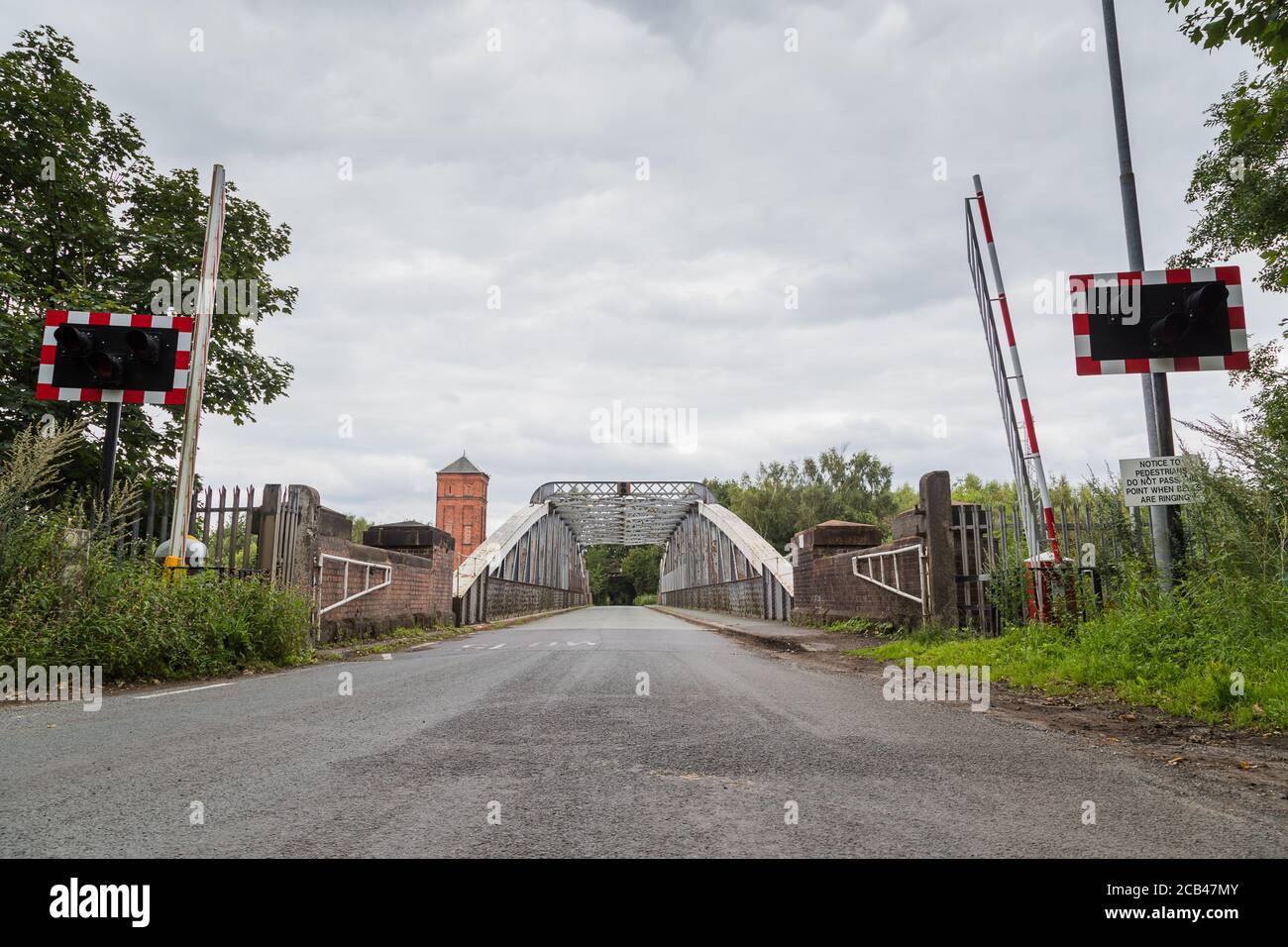 Barriers and lights on the Moore Lane swing bridge seen in Cheshire ...