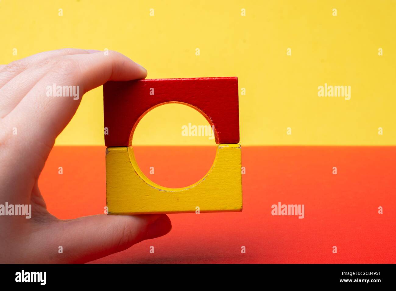 hand building tower with colorful building blocks Stock Photo - Alamy