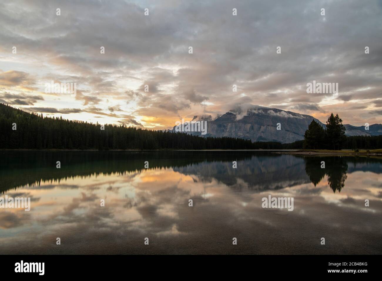 Mt. Rundle reflected in Two Jack Lake at dawn, Banff National Park ...