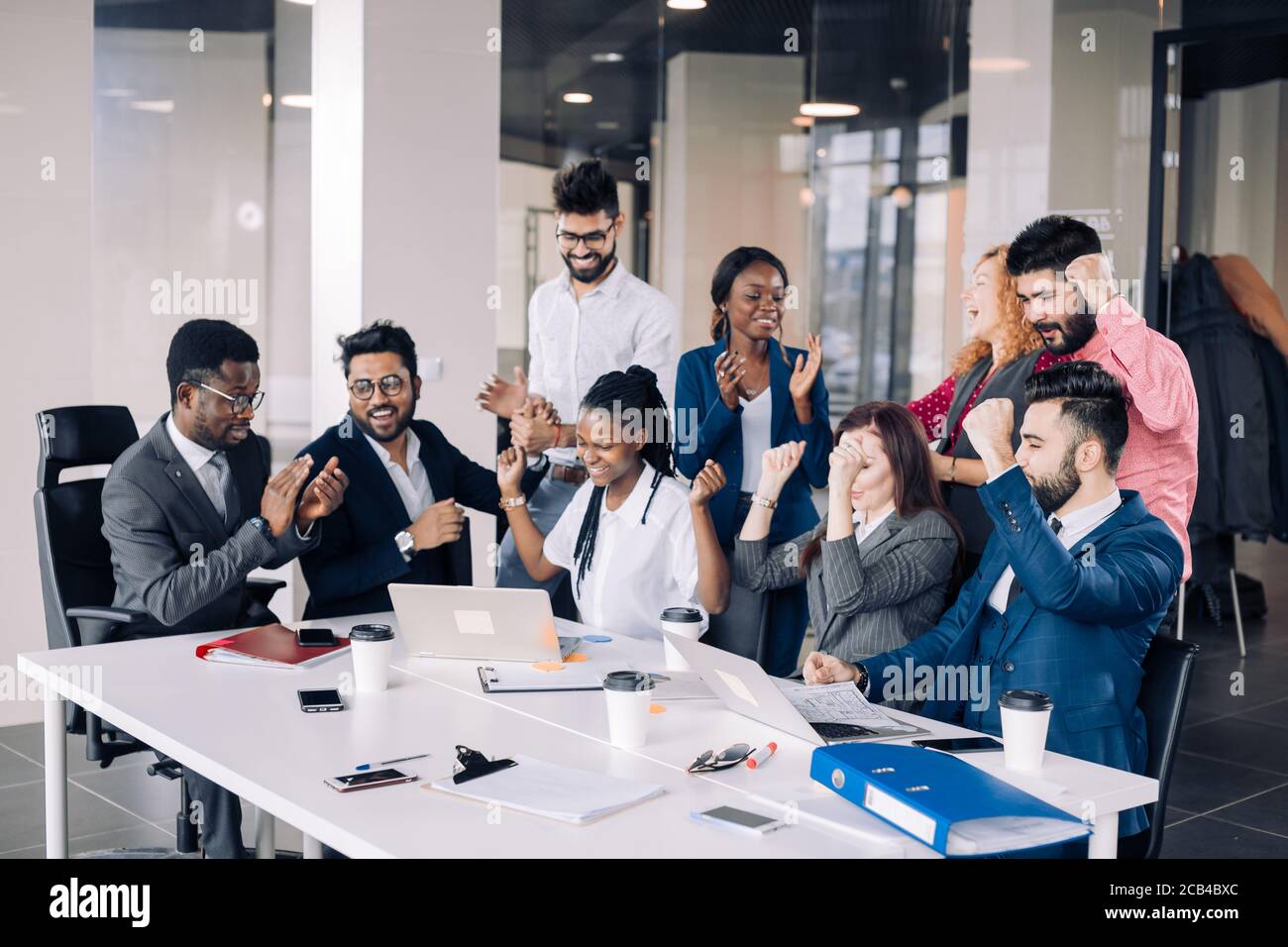 Nine young women seated hi-res stock photography and images - Alamy